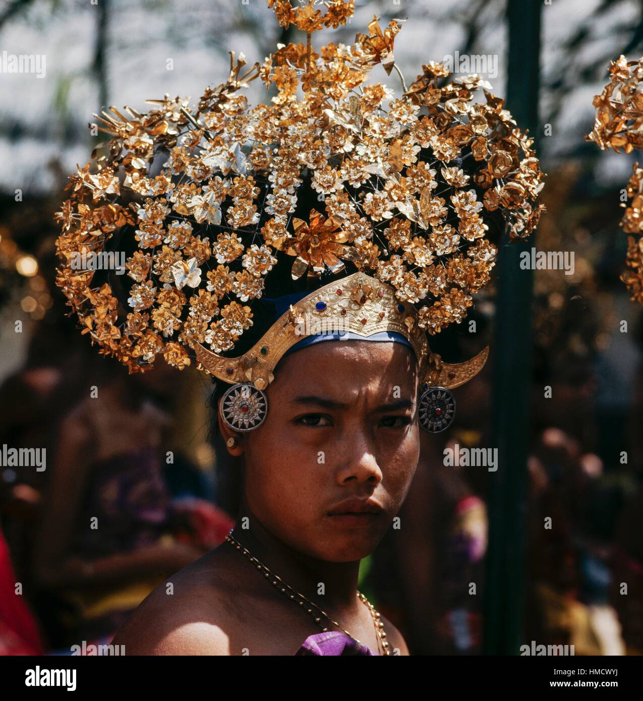 Dancer wearing a traditional headdress decorated with flowers, Bali ...