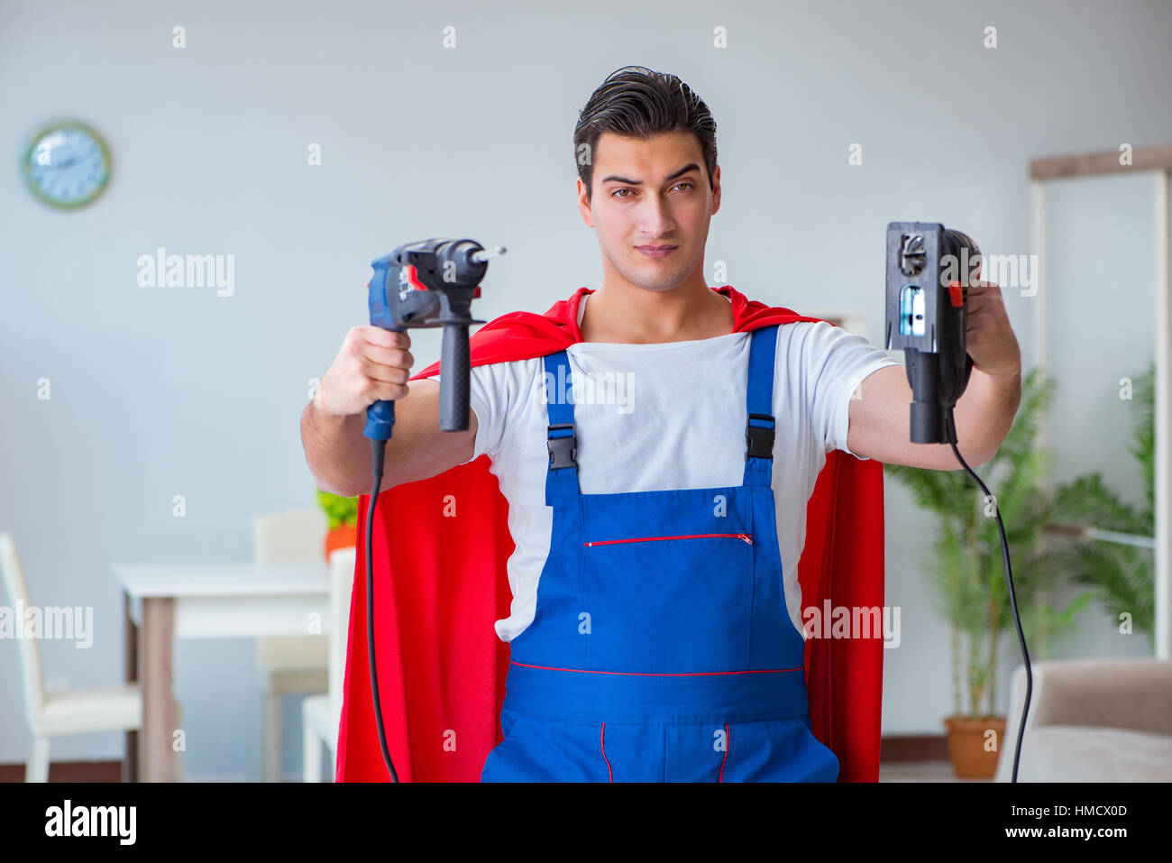 Super hero repairman working at home Stock Photo - Alamy