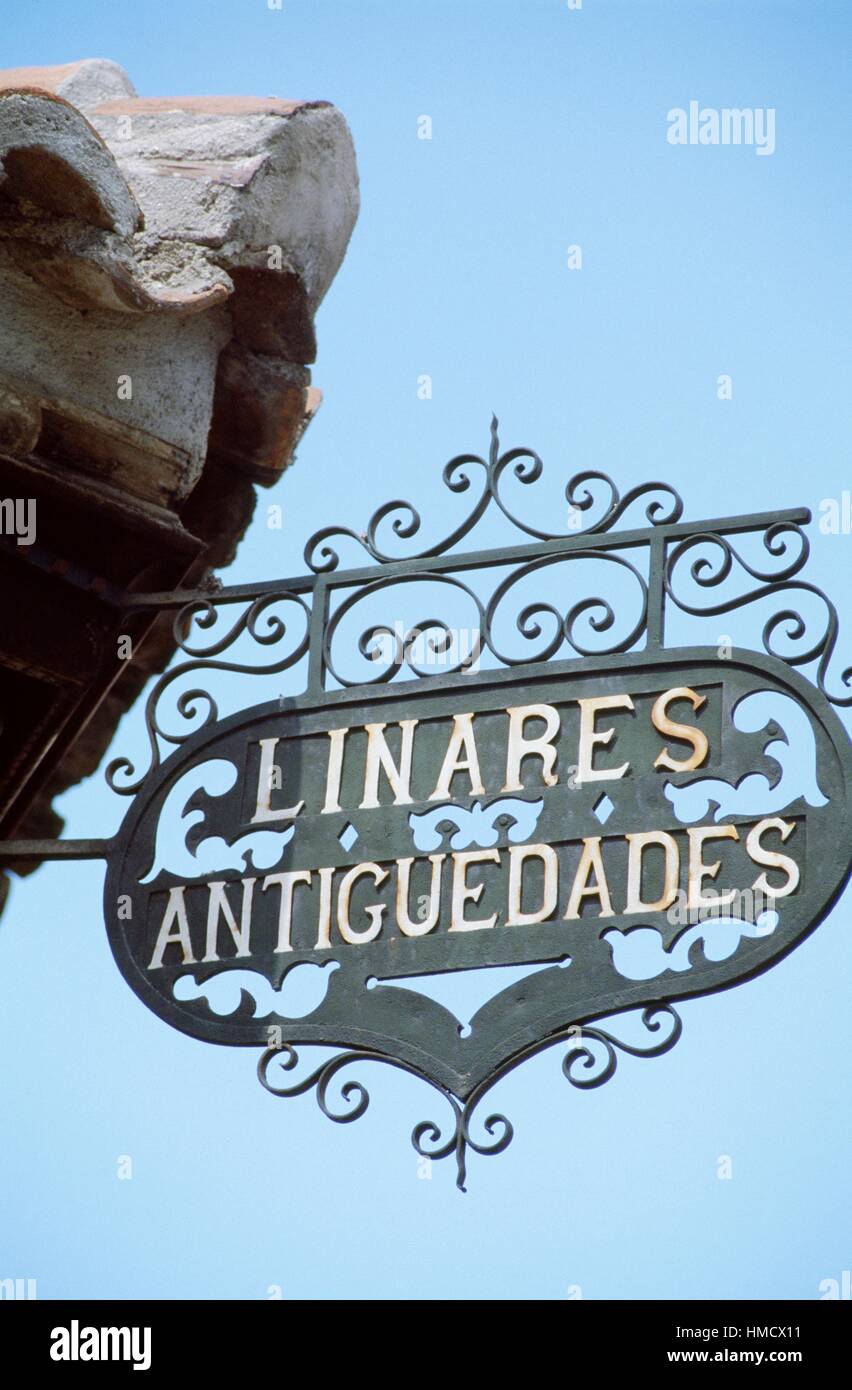 Wrought iron antique shop sign hi-res stock photography and images - Alamy