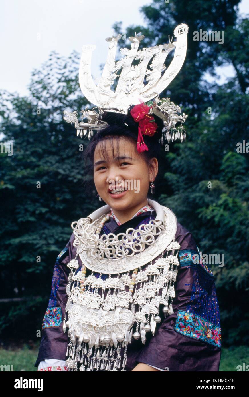 A girl wearing traditional ornaments, Miao people, China Stock Photo ...