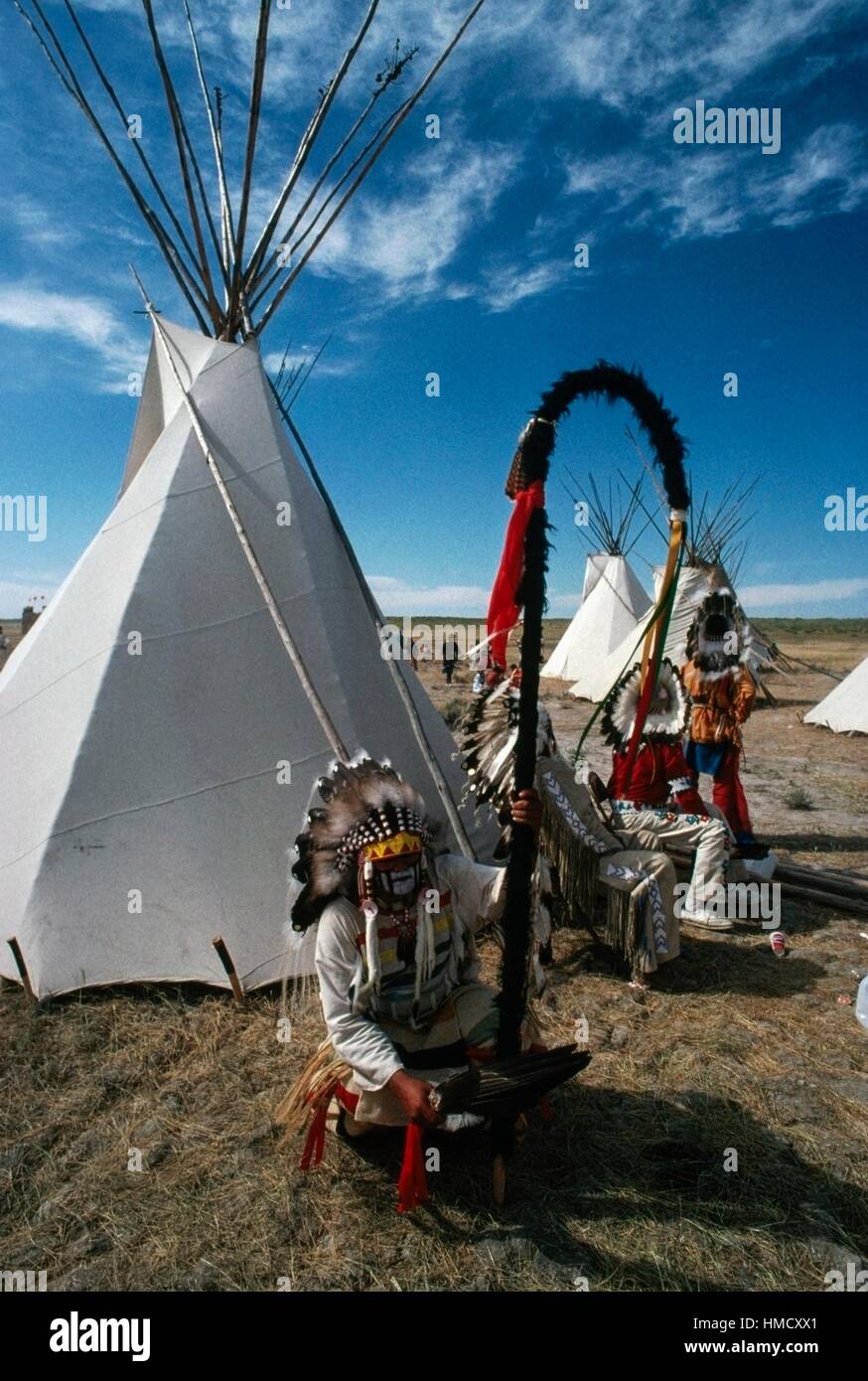 Native American wearing traditional clothes and feather headdress in ...