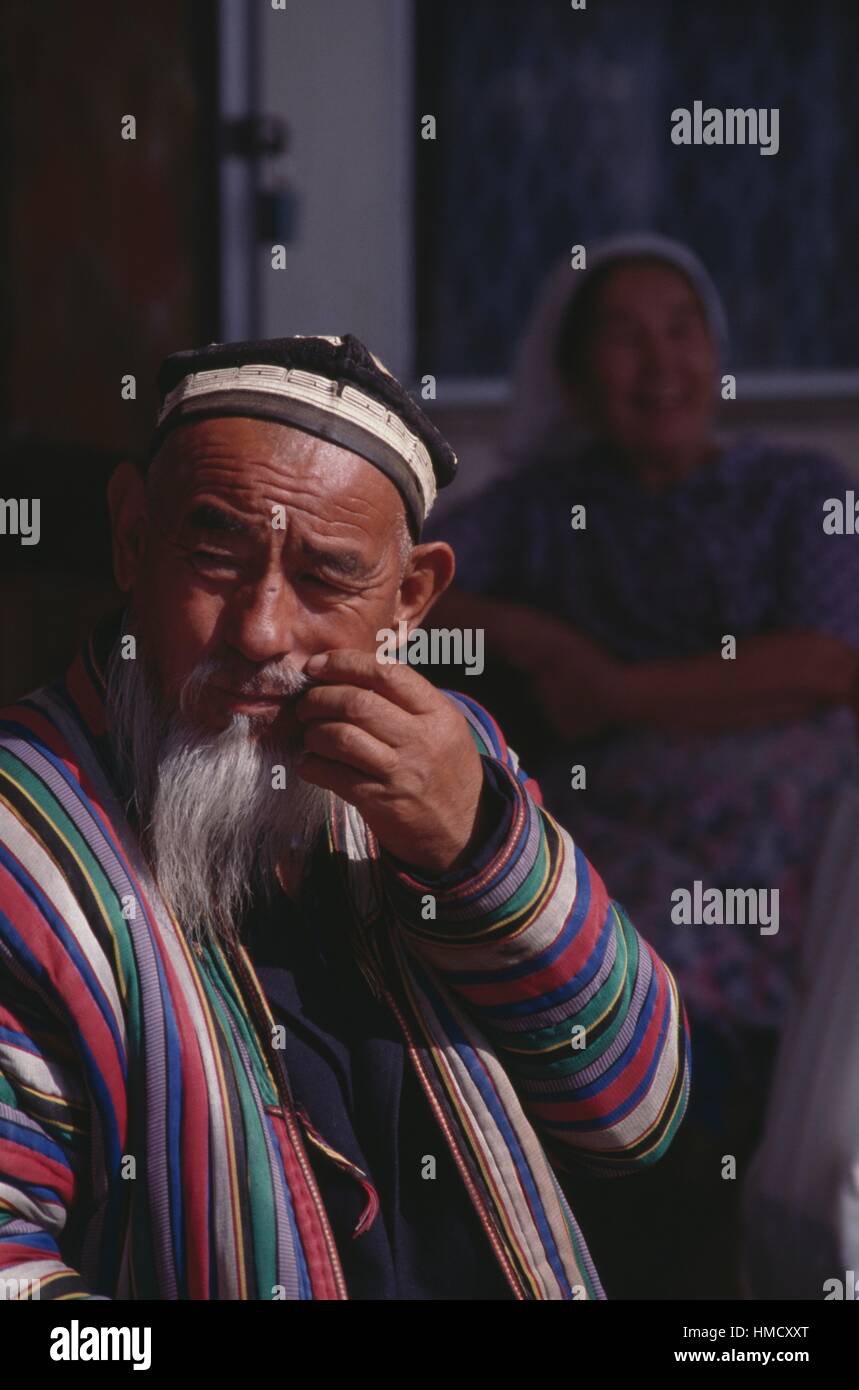 Man wearing a hat and traditional clothing, Samarkand, Uzbekistan Stock ...