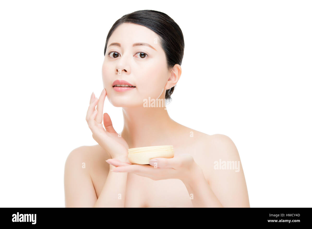 beauty asian woman applying facial lotion product on face. isolated on ...