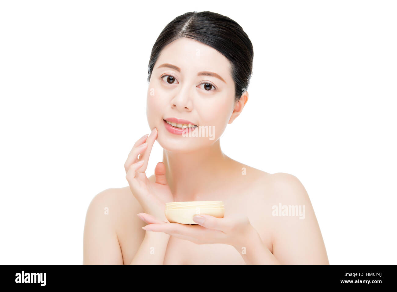beauty asian woman applying facial lotion product on face. isolated on ...