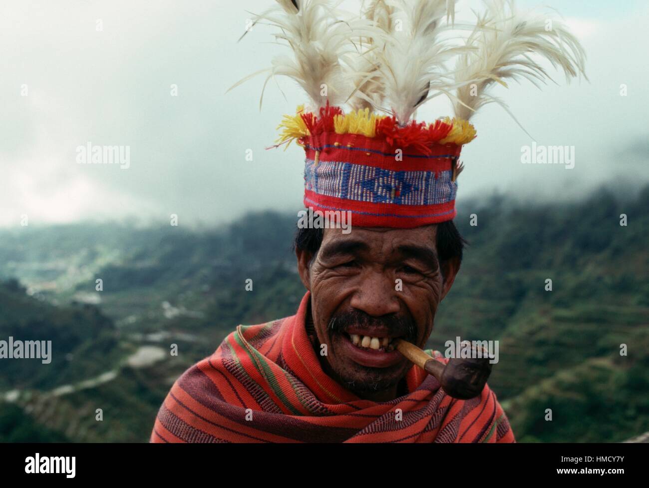 Ifugao village chief with pipe and feather headdress, Philippines Stock ...