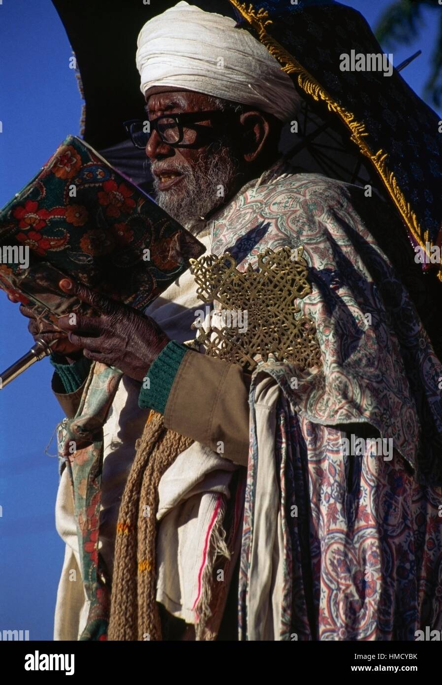 Priest holding a book of the holy scripture, Lalibela, Ethiopia Stock ...