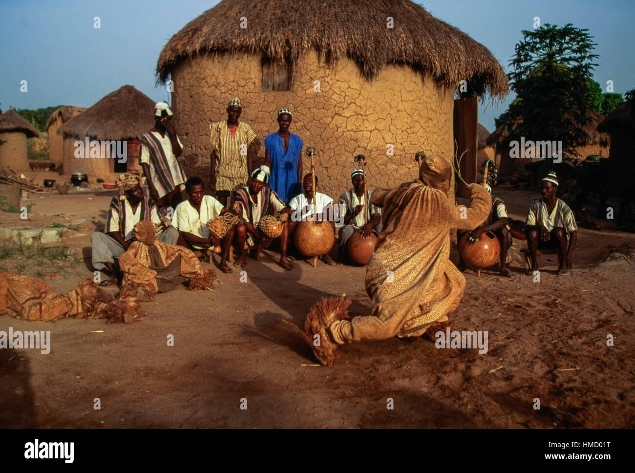 Men performing the panther dance, and men playing musical instruments ...