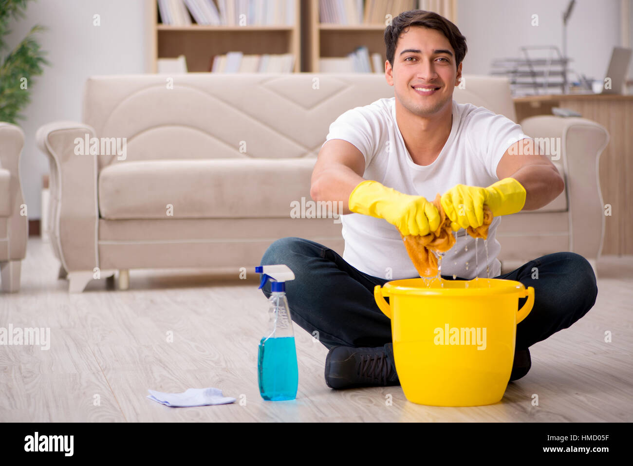 Man husband cleaning the house helping wife Stock Photo - Alamy