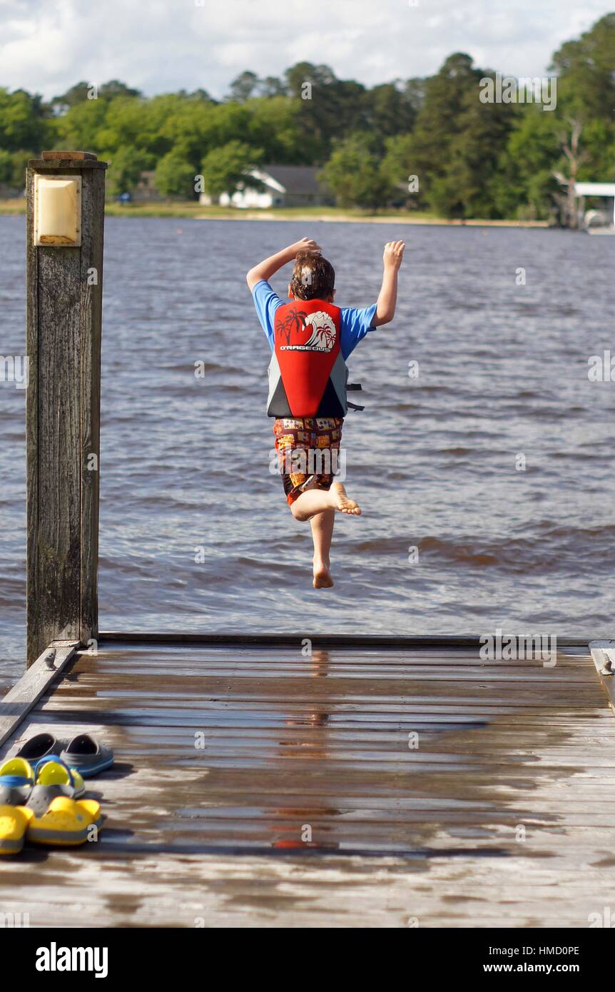 Jumping off dock hi-res stock photography and images - Alamy
