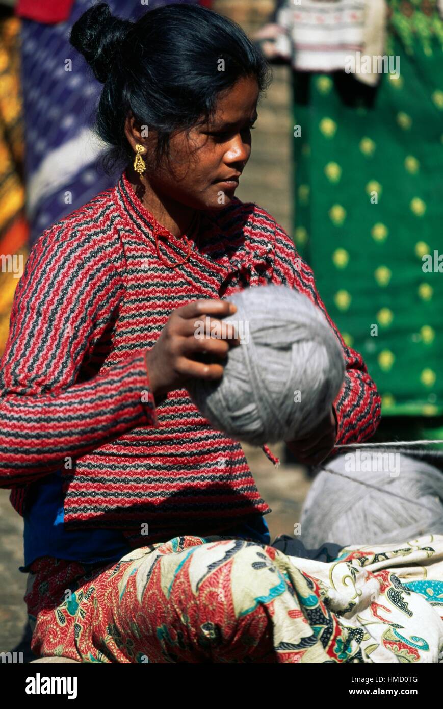 Woman with a ball of wool, Jawalakhel, Patan, Kathmandu valley, Nepal ...