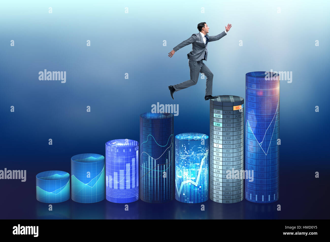 Businessman jumping over bar charts Stock Photo - Alamy