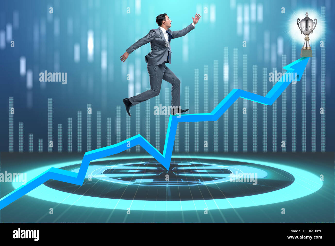 Businessman running towards prize cup trophy Stock Photo - Alamy