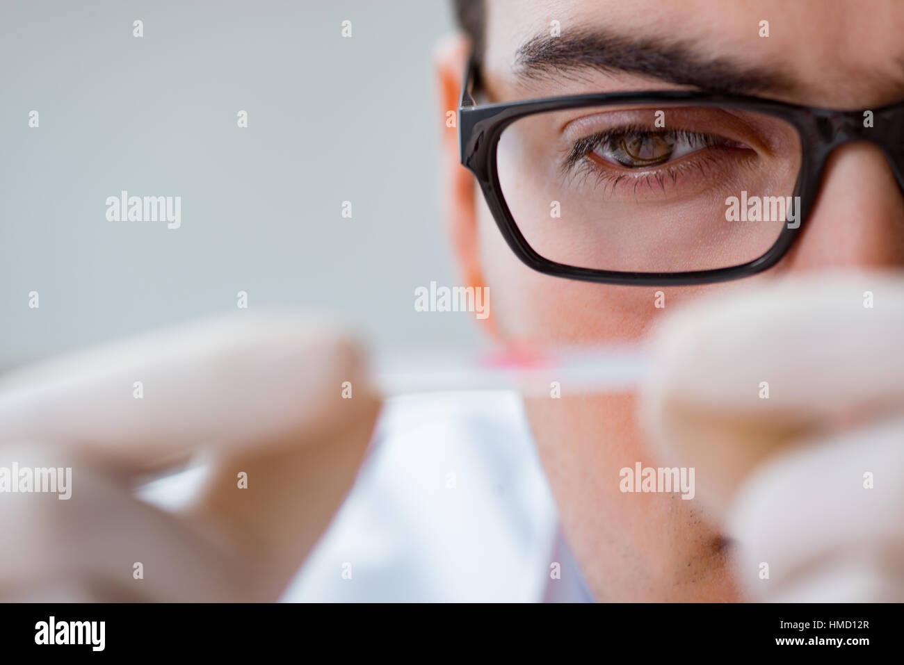Young doctor doing the blood test Stock Photo - Alamy