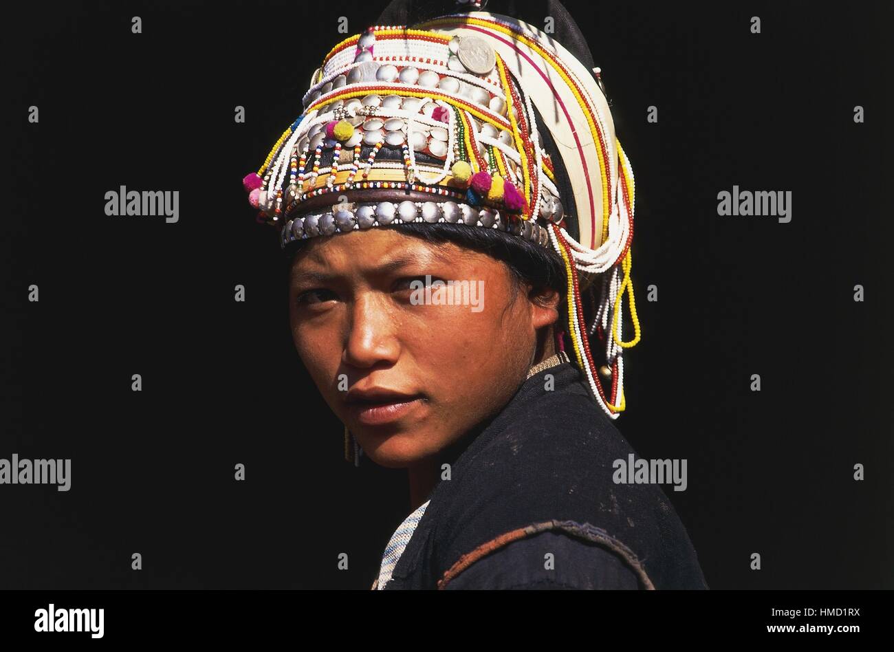 An Akhan woman wearing a headdress, the village of Ban Lakkham Mai near ...