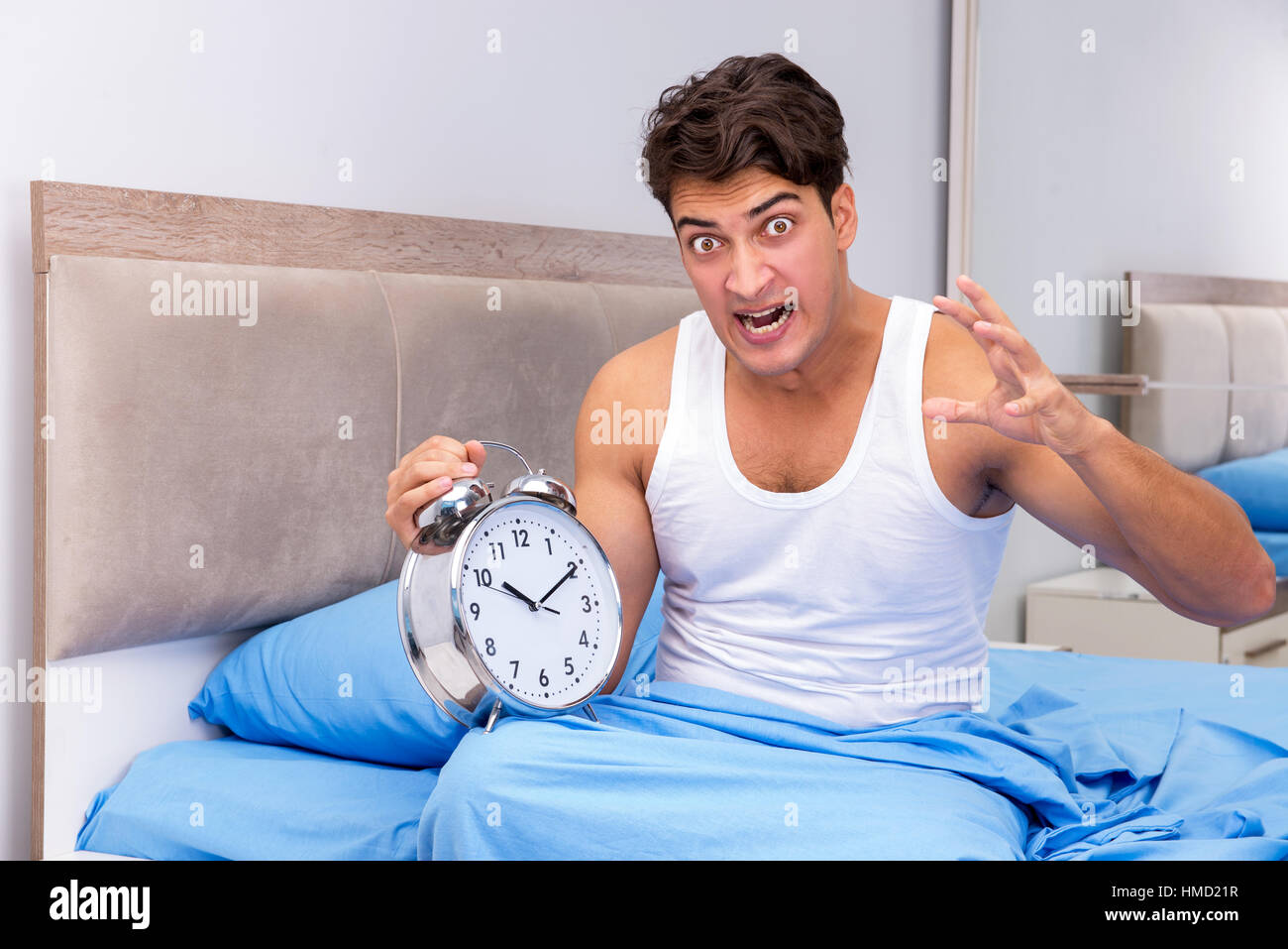 Man having trouble waking up in morning Stock Photo - Alamy