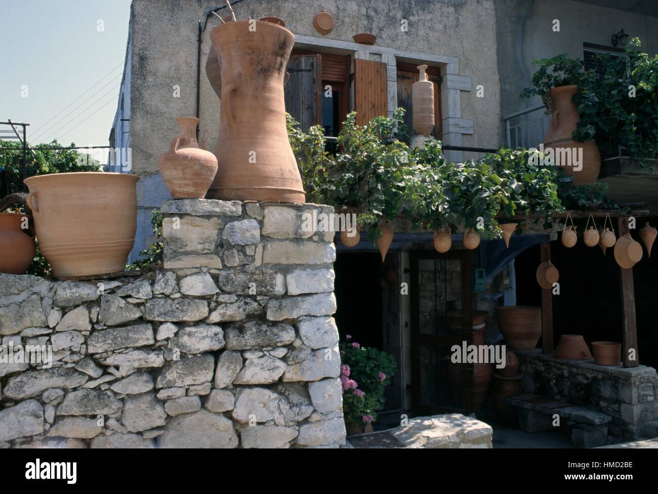 Terracotta pottery in front of a house in Margarites, Crete, Greece ...