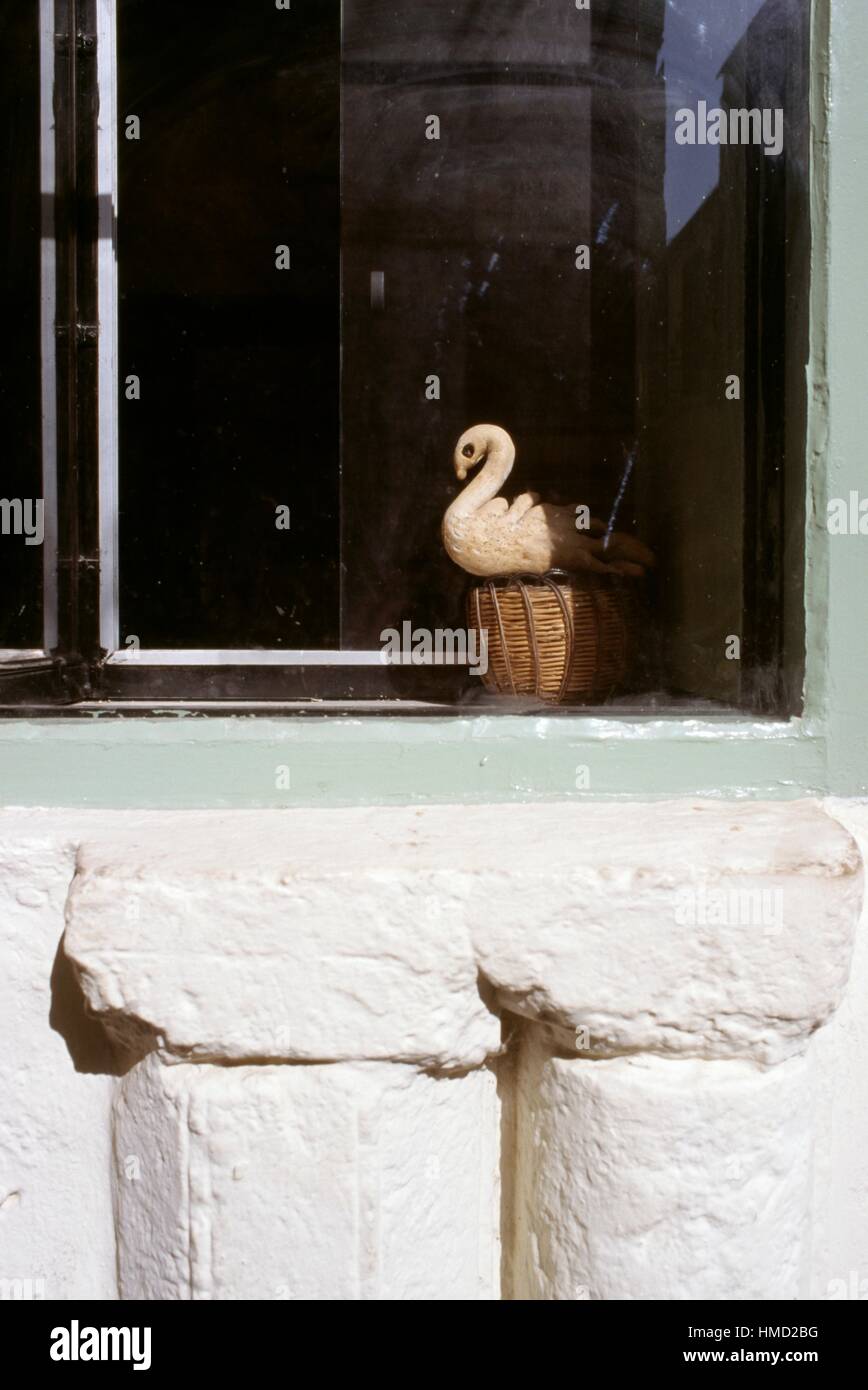 Swan-shaped bread sculpture in front of a window, Rethymno, Crete ...