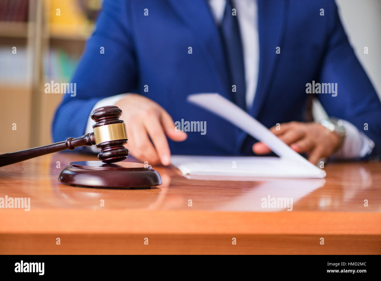 Handsome judge with gavel sitting in courtroom Stock Photo - Alamy