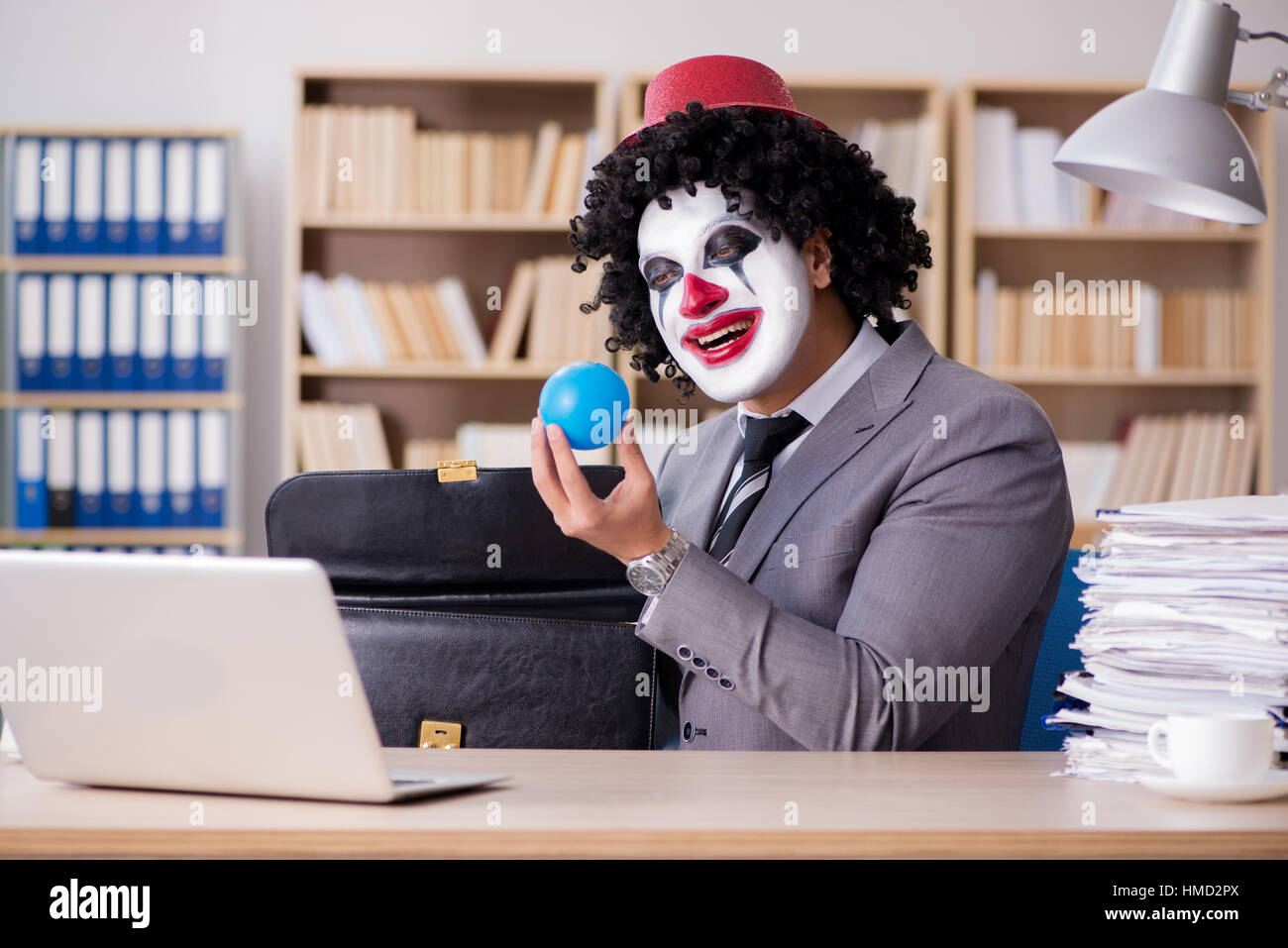 Clown businessman working in the office Stock Photo - Alamy