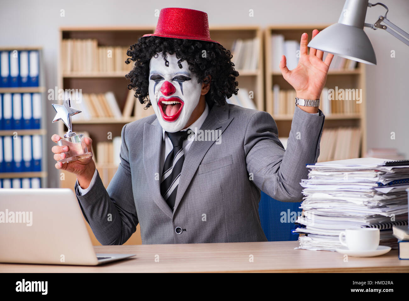 Clown businessman working in the office Stock Photo - Alamy