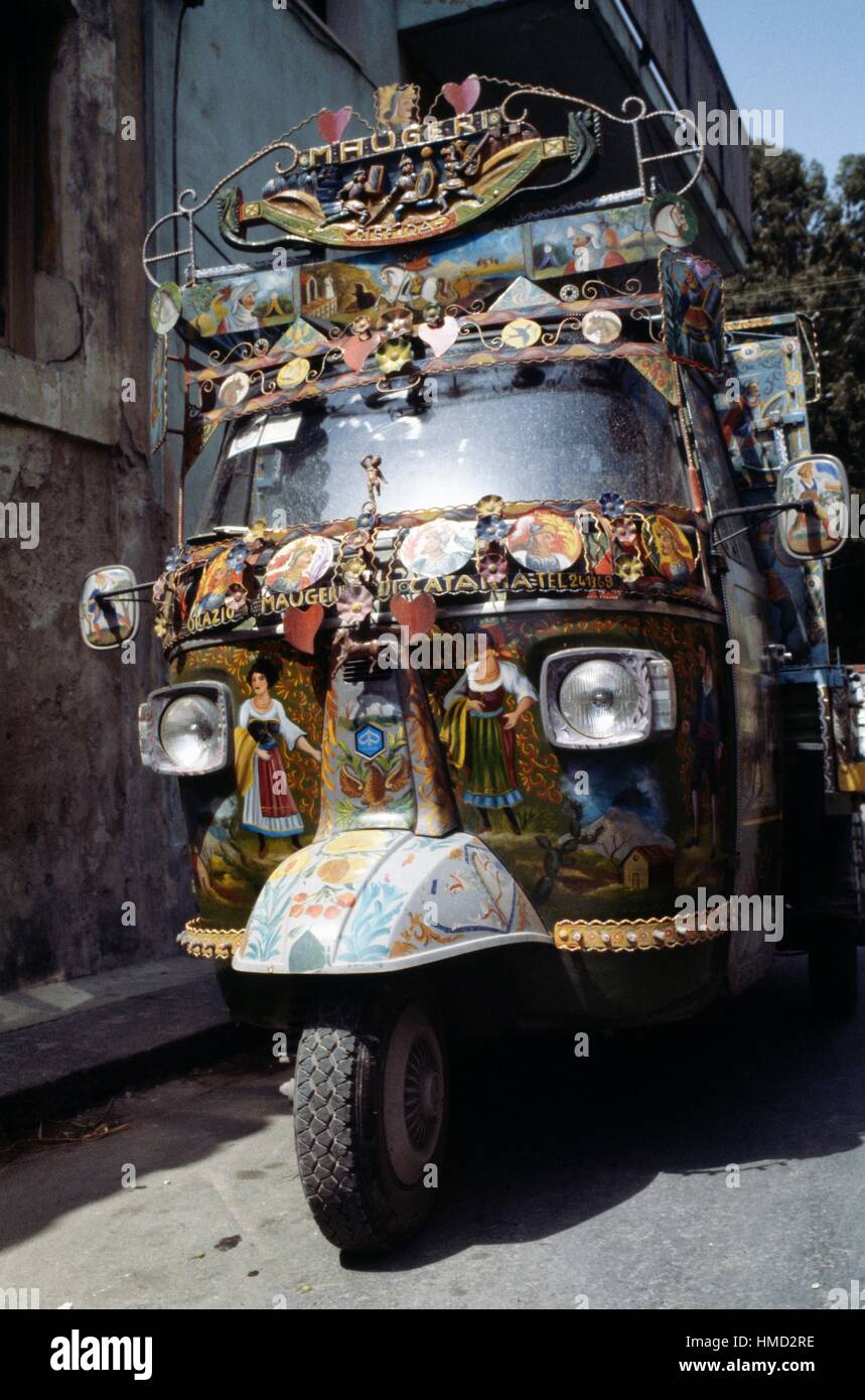 Three-wheeled vehicle (Ape Piaggio) with decoration inspired by ...