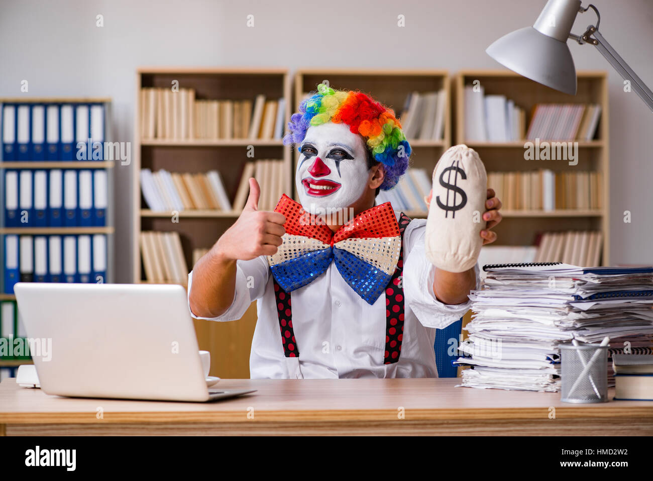 Clown businessman working in the office Stock Photo - Alamy
