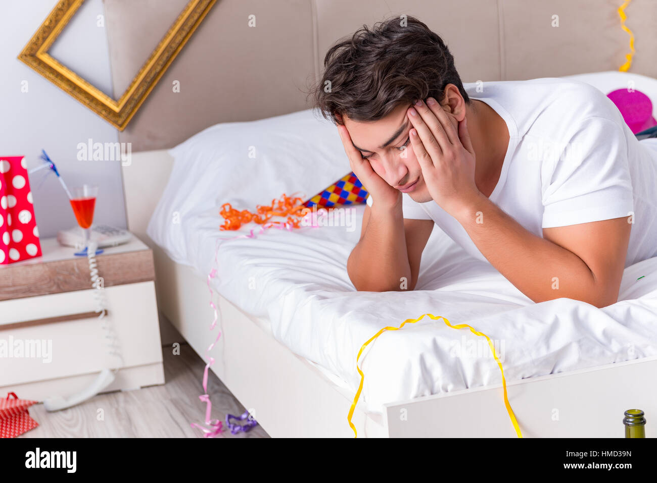 Man after heavy christmas partying at home Stock Photo - Alamy