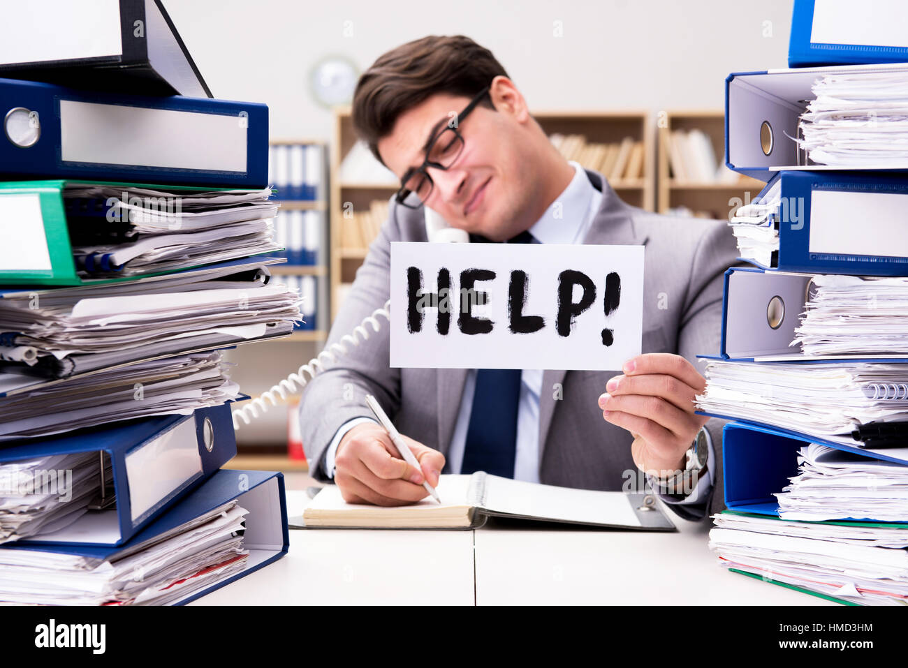 Busy businessman asking for help with work Stock Photo - Alamy