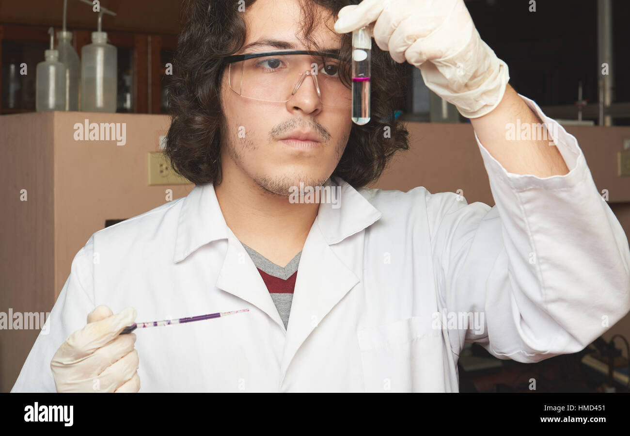 close up young chemist mixing colour reagent in lab Stock Photo - Alamy