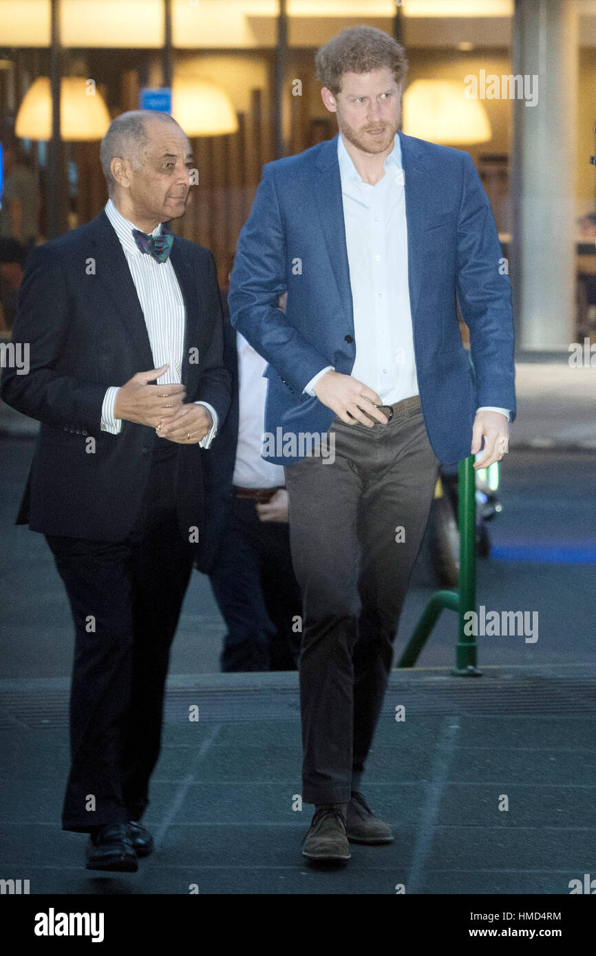 Prince Harry talks with Kenneth Olisa, the Lord Lieutenant of Greater ...