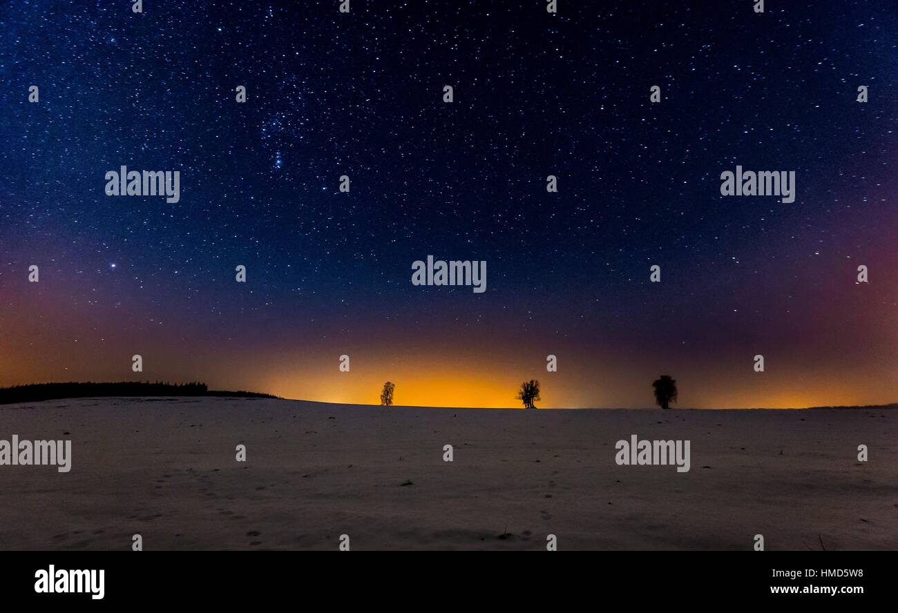 Night sky over winter snowy fields. Natural starry sky landscape in ...