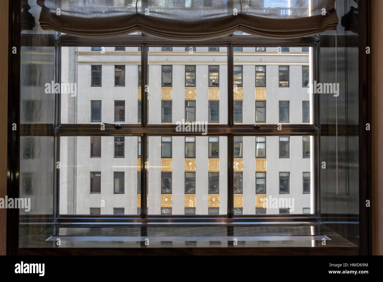 Looking at an office building across the street, from a fourth floor ...