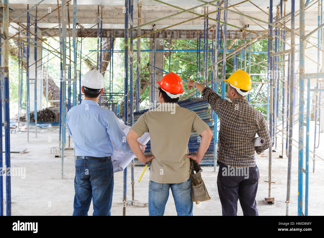 Construction concepts, Engineer and Architect working at Construction Site with blueprint Stock ...