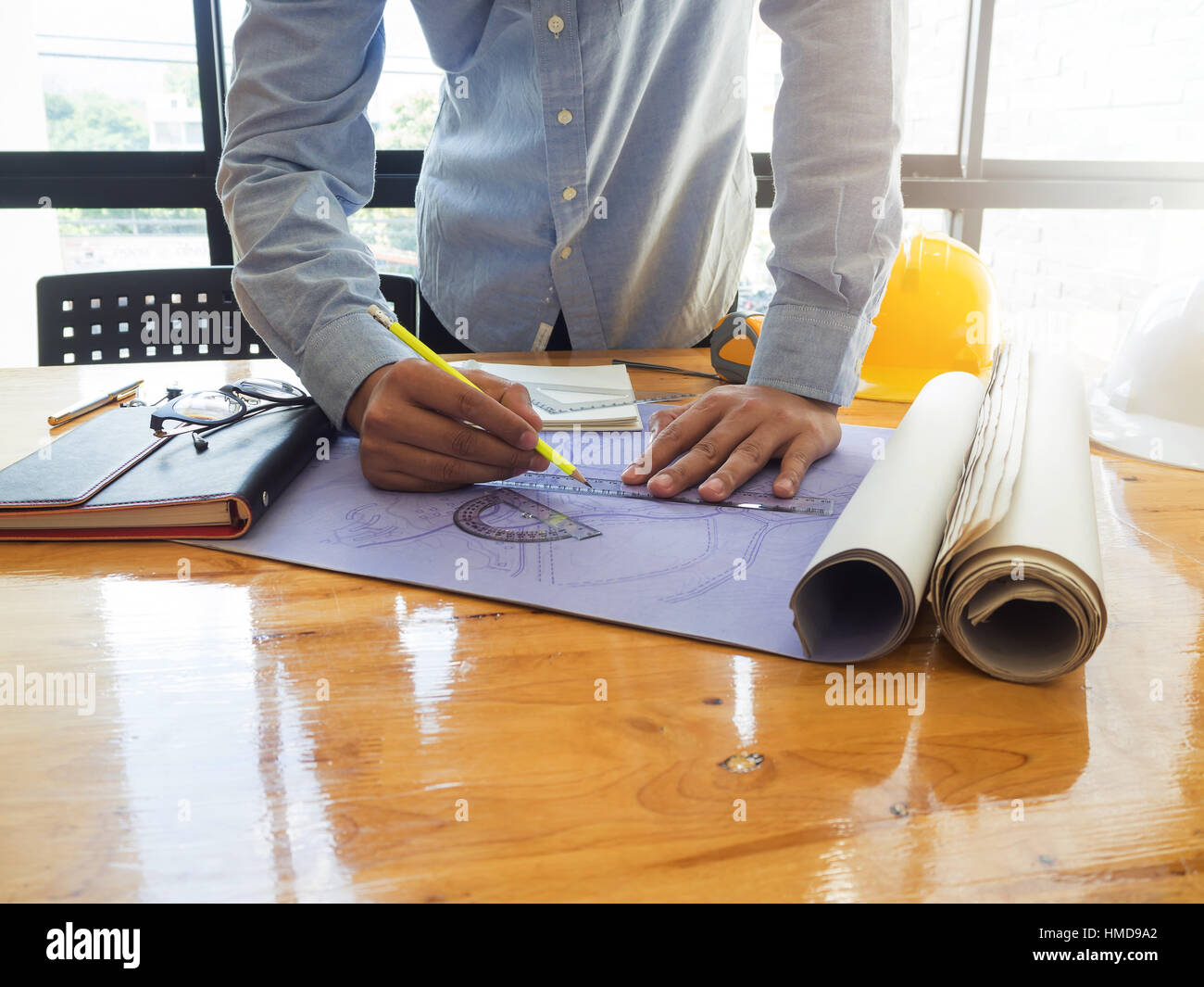 Architect concept, Architects working with blueprints in the office ...