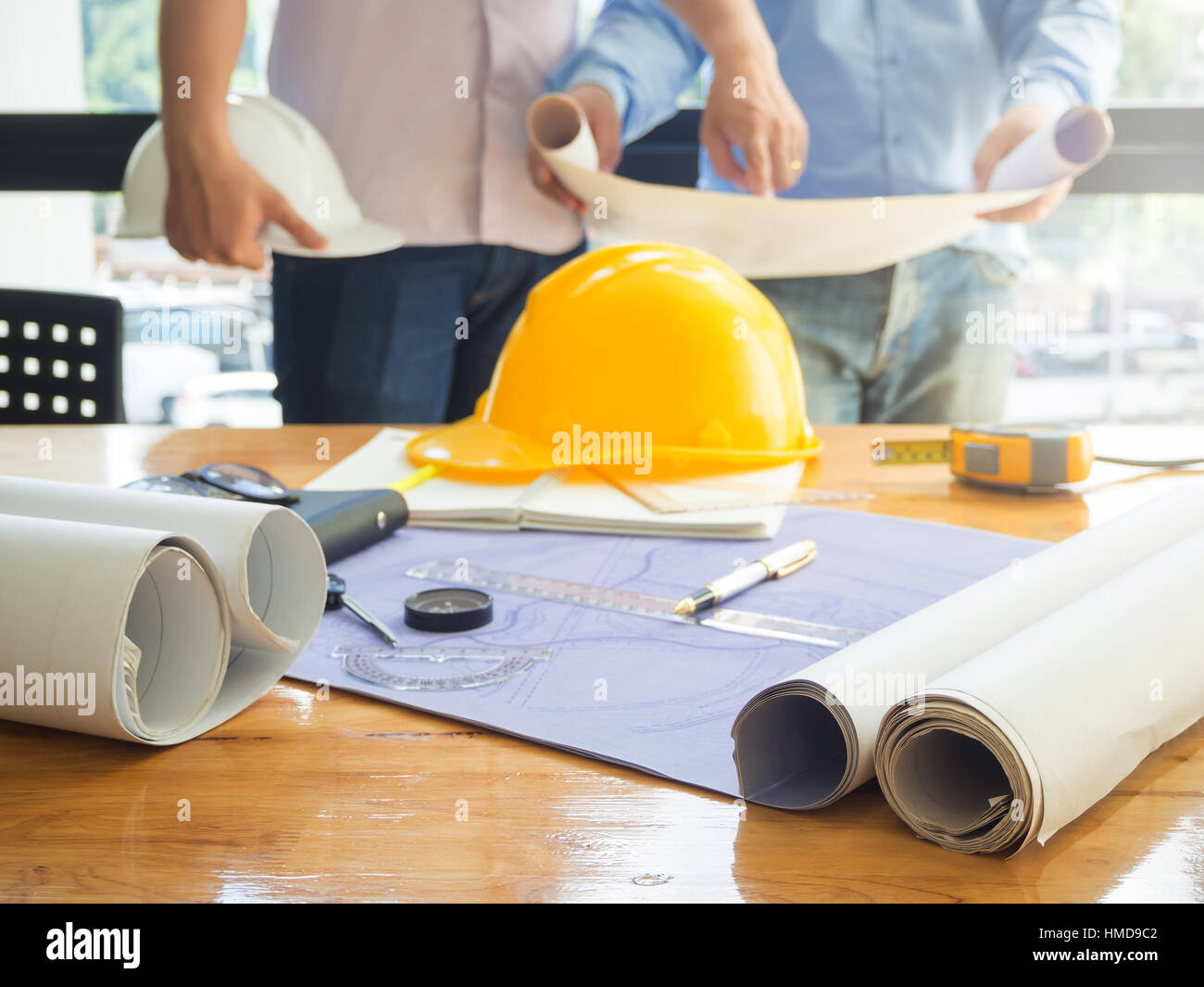 Architect concept, Architects working with blueprints in the office ...