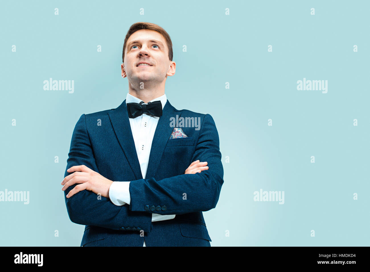 Portrait of handsome and elegant business man wearing bow tie and suits ...