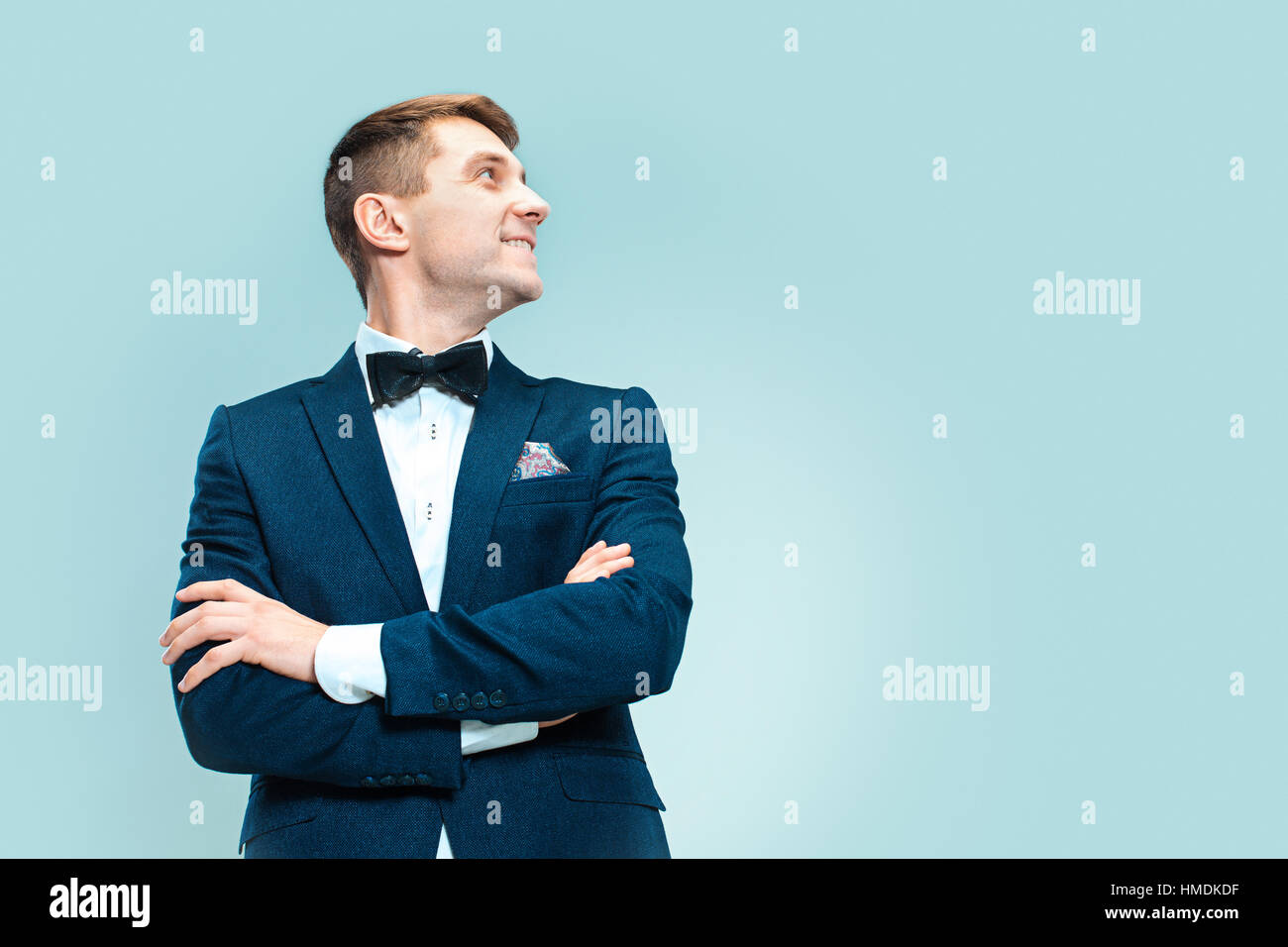 Portrait of handsome and elegant business man wearing bow tie and suits ...