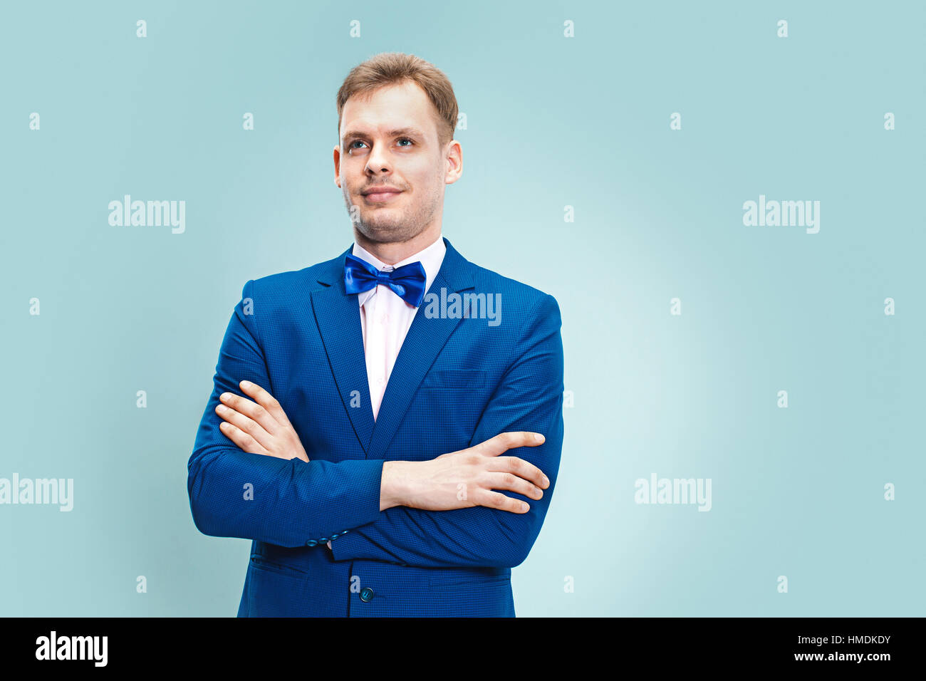 Portrait of handsome and elegant business man wearing bow tie and suits ...
