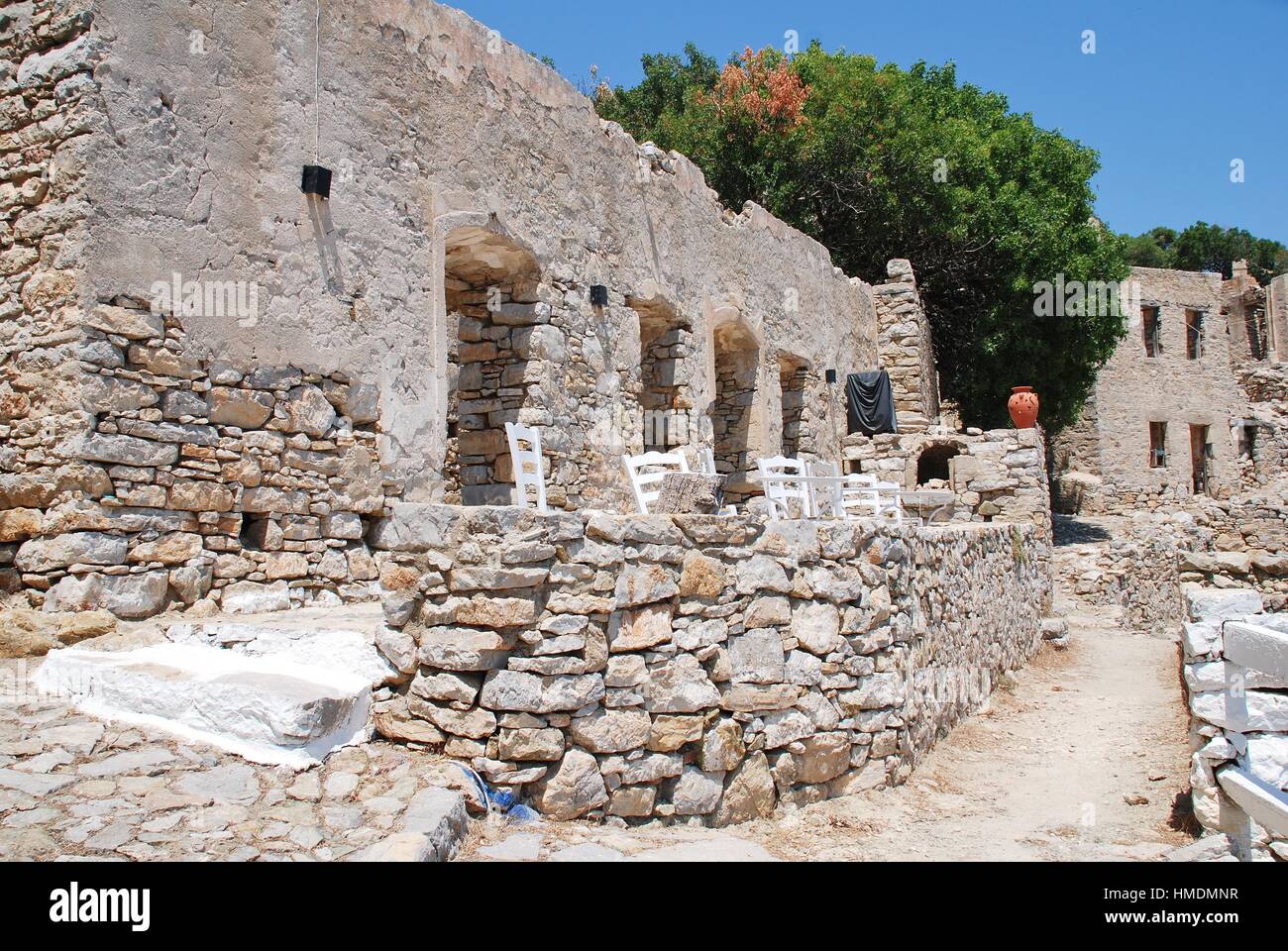 The ruins of the abandoned village of Mikro Chorio on the Greek island ...