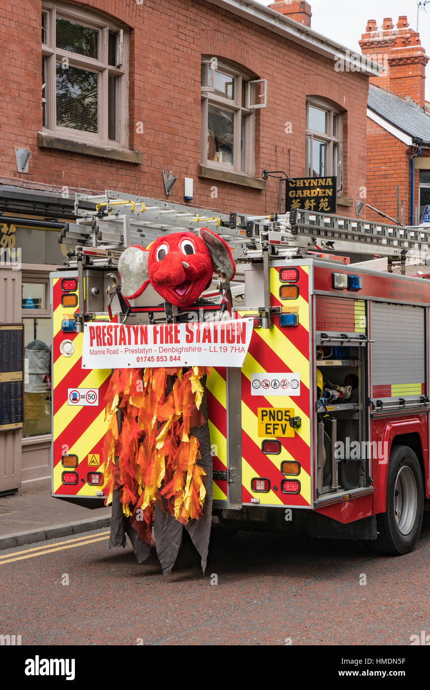 A red elephant mascot on a fire engine in the Prestatyn Carnival parade ...