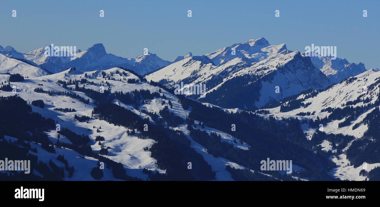 Snow covered mountains in Vaud Canton. View from the Rellerli ski area ...