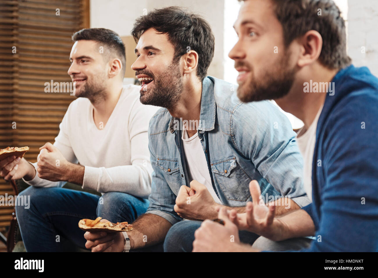 Cheerful positive men smiling Stock Photo - Alamy