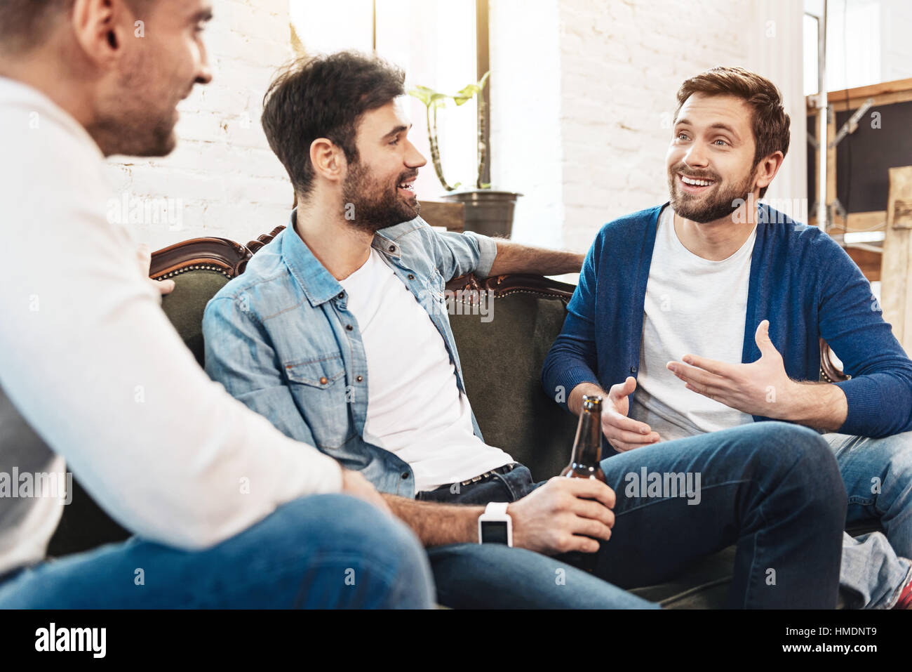 Nice joyful men chatting with each other Stock Photo - Alamy