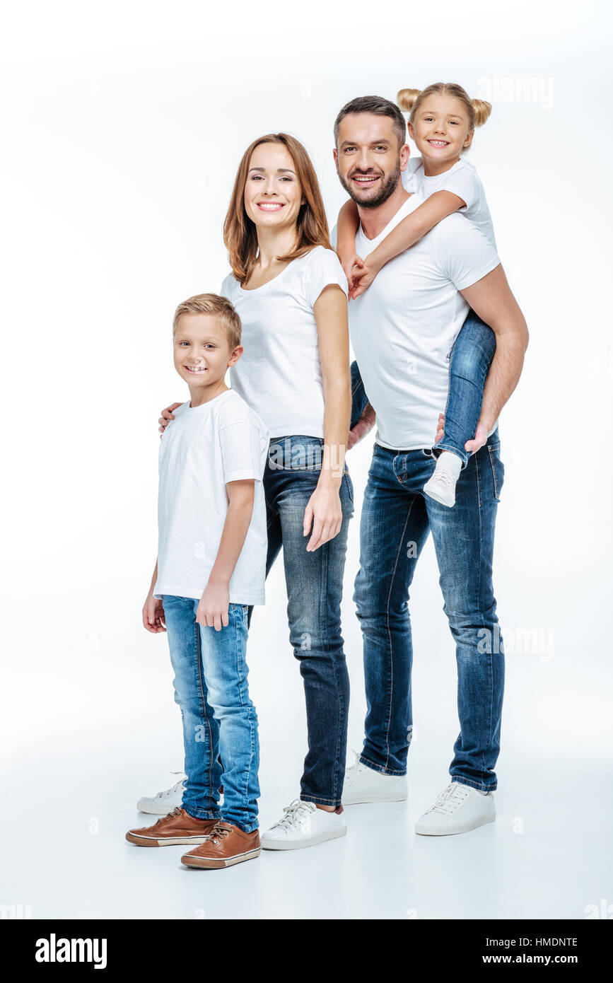 Happy family standing together Stock Photo - Alamy