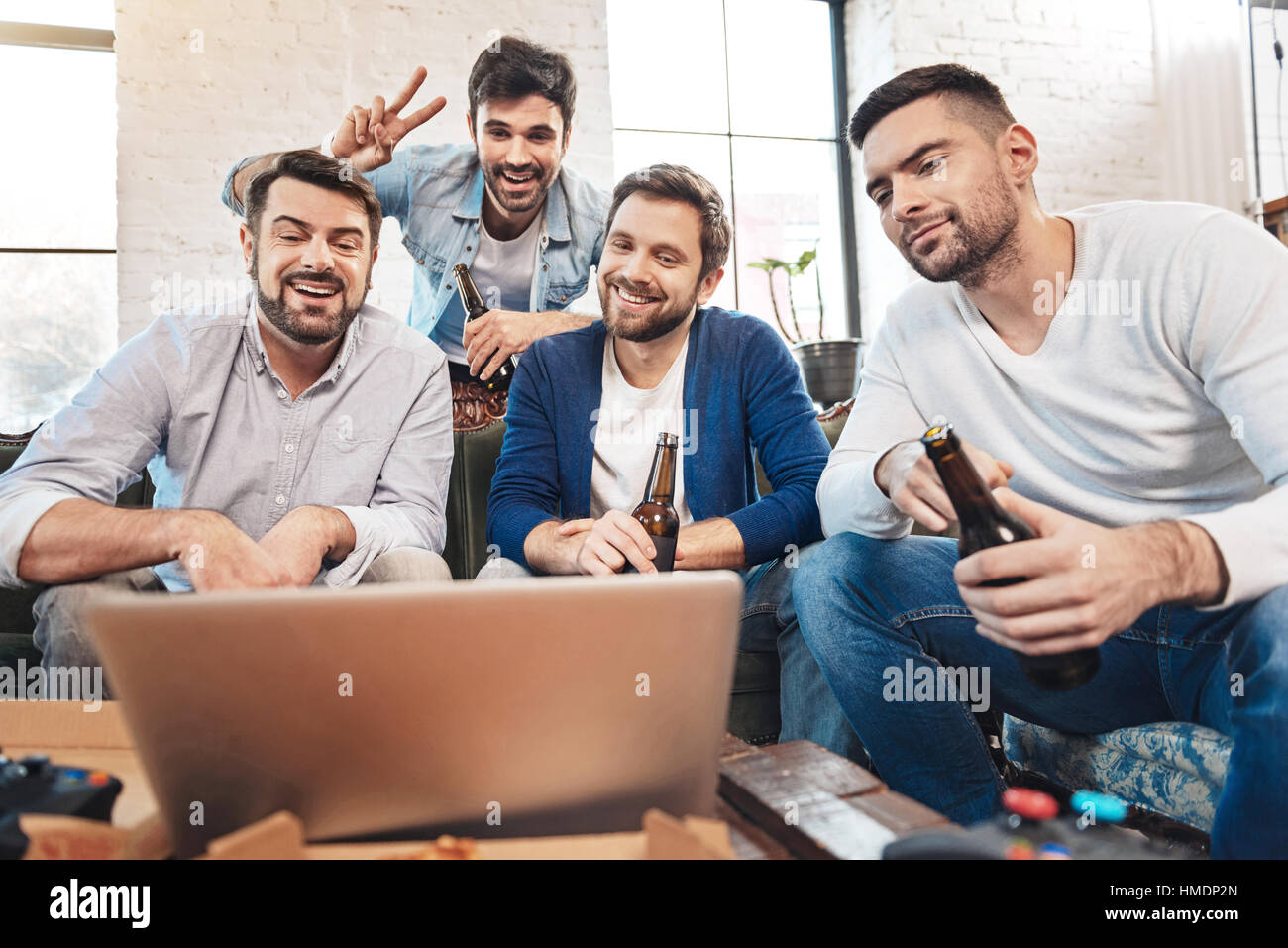 Cheerful positive friends speaking via the Internet Stock Photo - Alamy