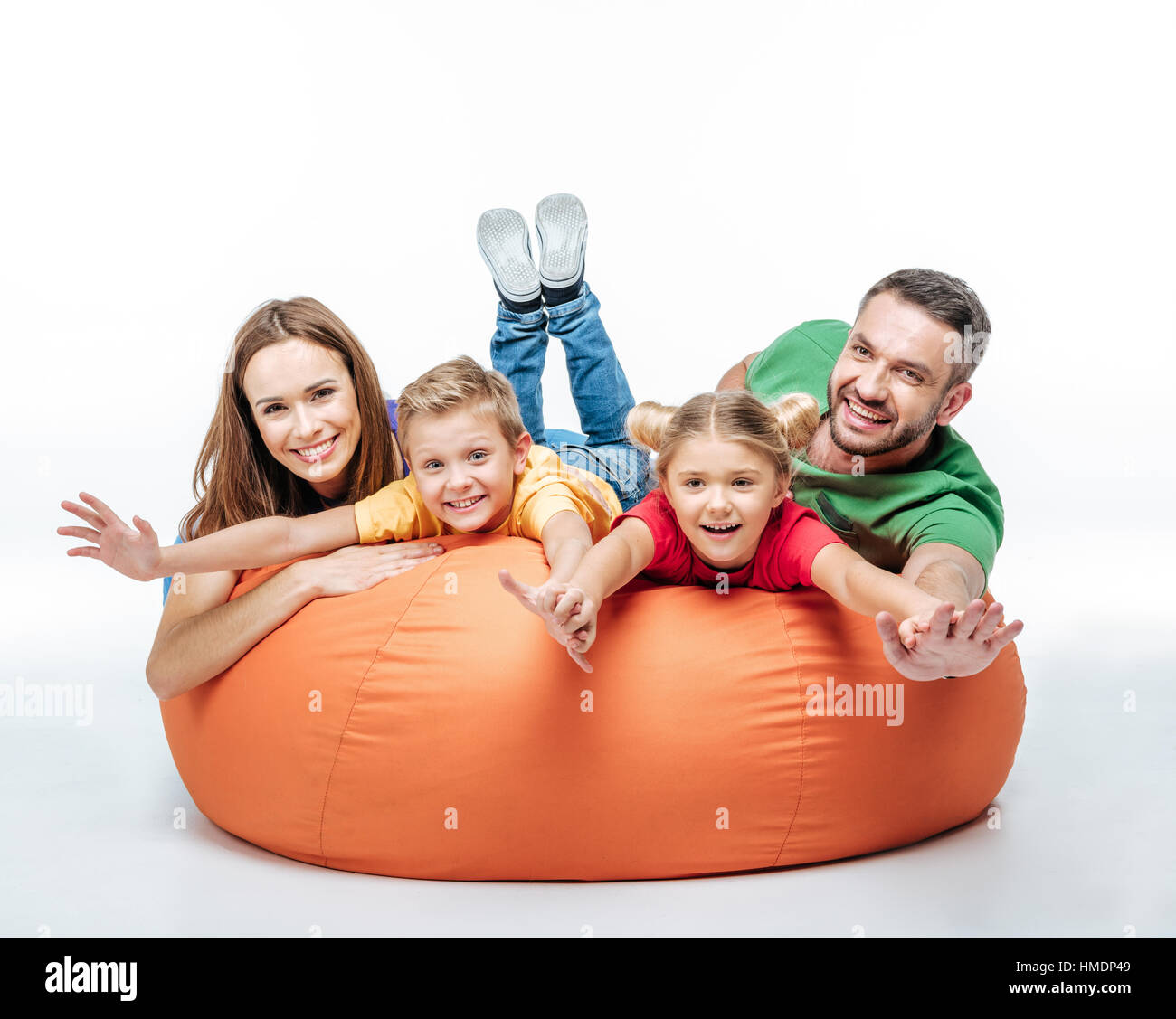 Family having fun in sack-chair Stock Photo - Alamy