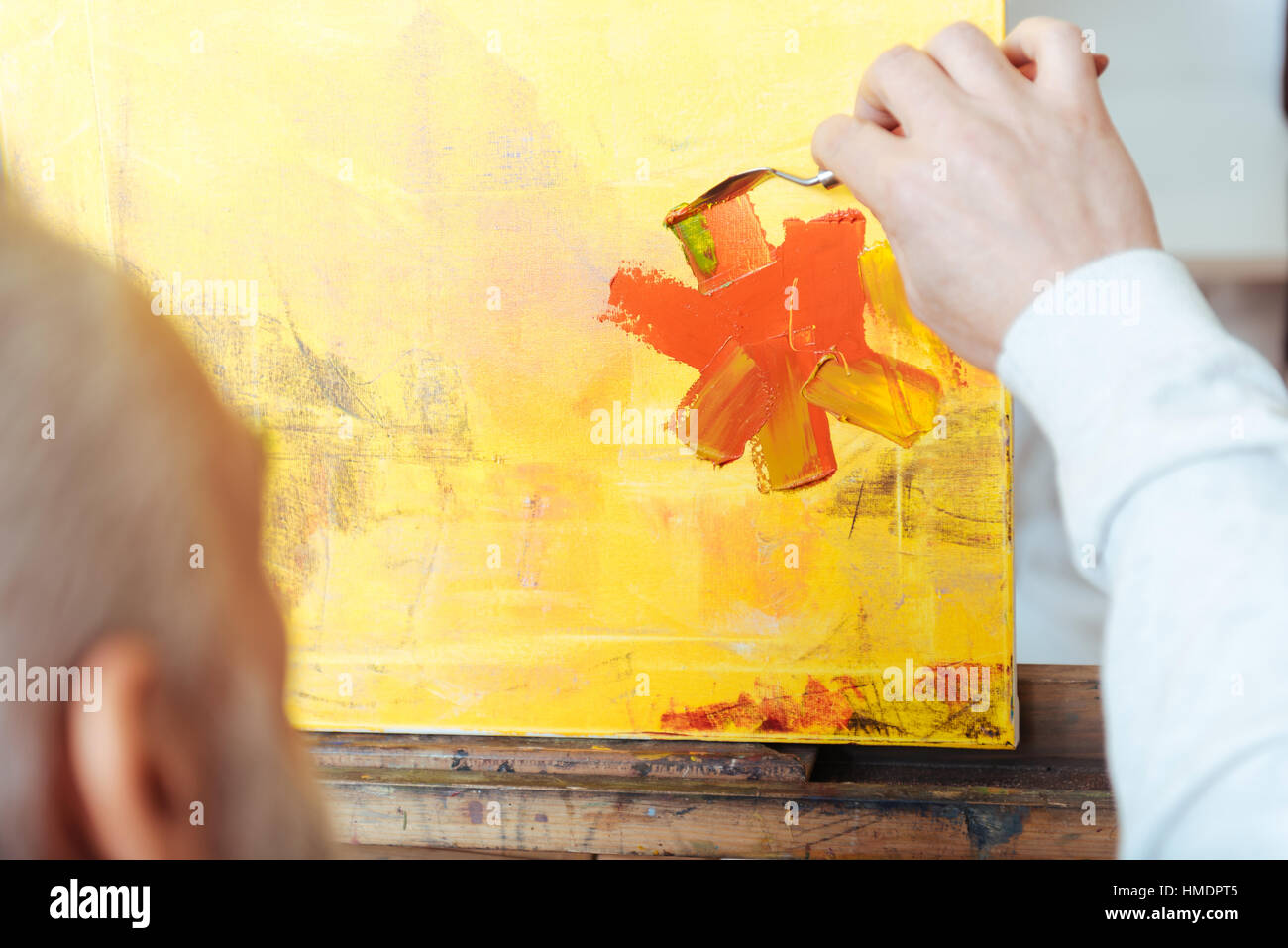Close up of artists hands painting a picture Stock Photo - Alamy