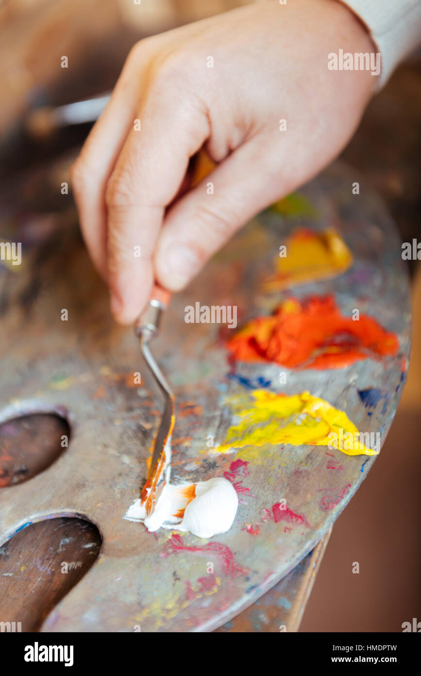 Close up of artists hands mixing the paints Stock Photo - Alamy