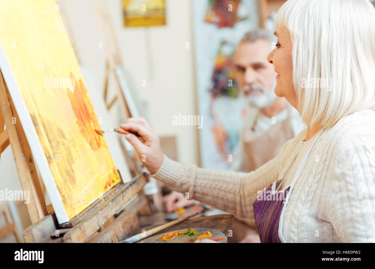 Female artist painting in class Stock Photo - Alamy