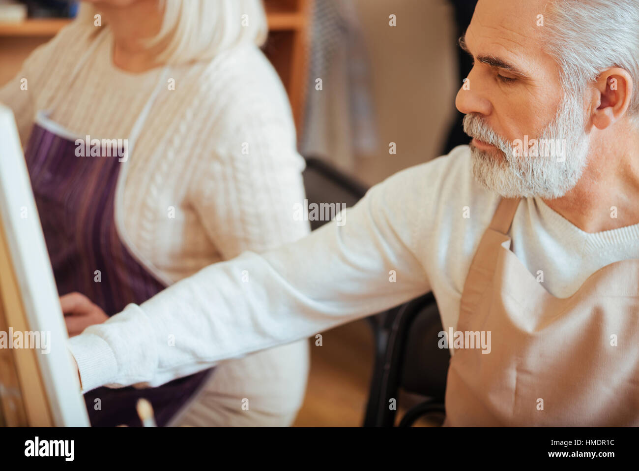 Close up of colleagues drawing together Stock Photo - Alamy